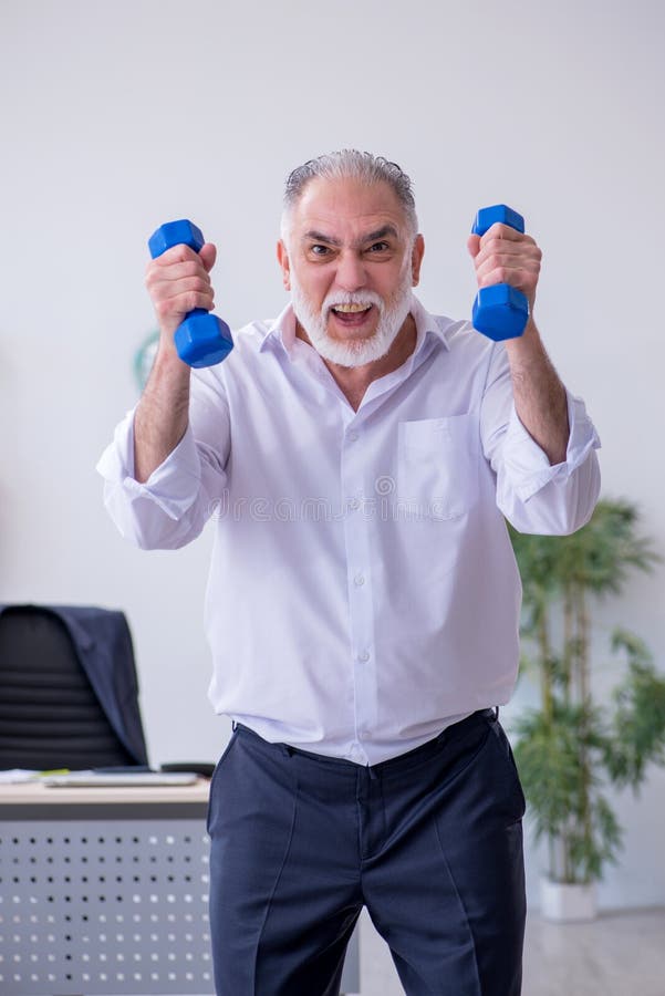Aged Male Employee Doing Physical Exercises during Break Stock Photo ...