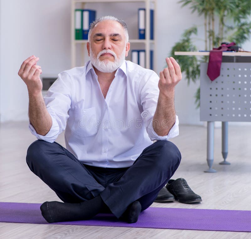 Aged Male Employee Doing Physical Exercises during Break Stock Photo ...