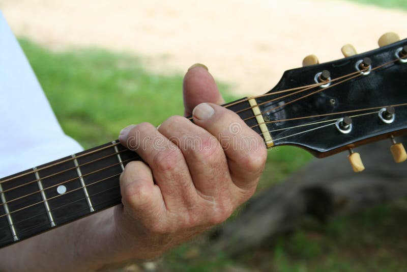 Aged Hand Playing Guitar Picture. Image: 1077785
