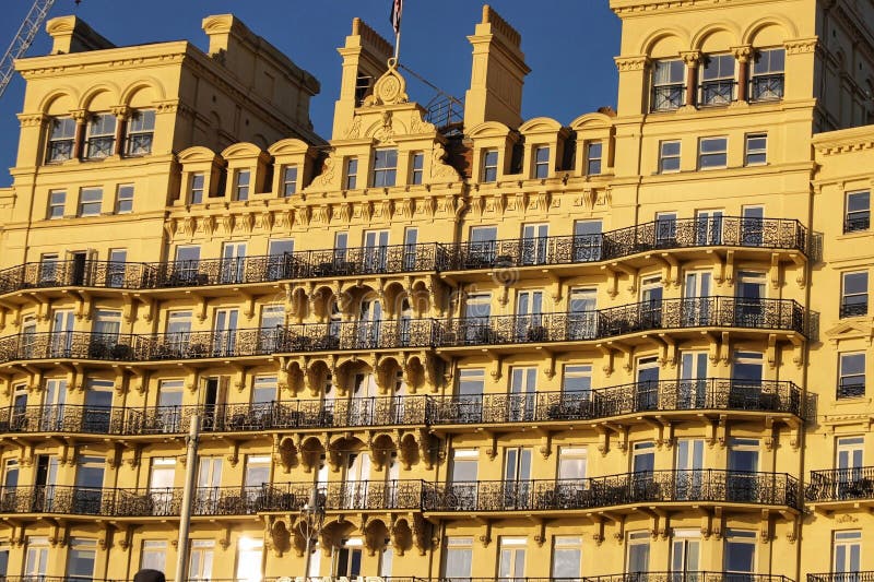 Aged Hotel Building with Multiple Balconies on the Upper Level ...