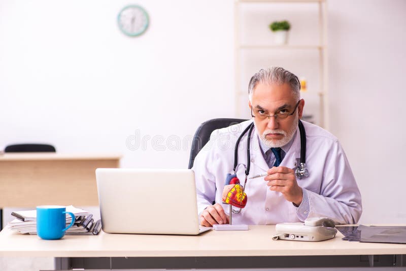 Aged Male Doctor Cardiologist Working in the Clinic Stock Image - Image ...
