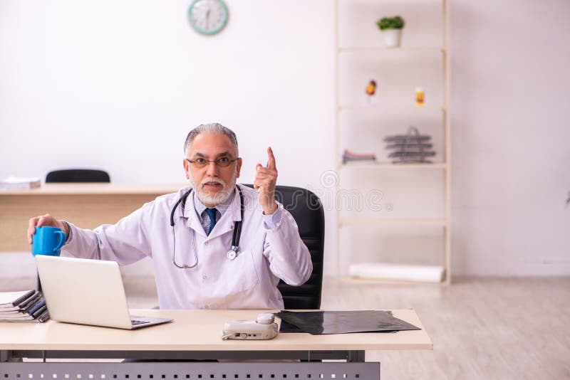 Aged Male Doctor Drinking Coffee in the Clinic Stock Photo - Image of ... Aged Male Doctor Drinking Coffee in the Clinic Stock Photo - Image of ...