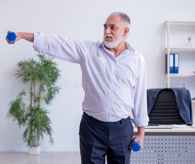 Aged Male Employee Doing Physical Exercises during Break Stock Image ...