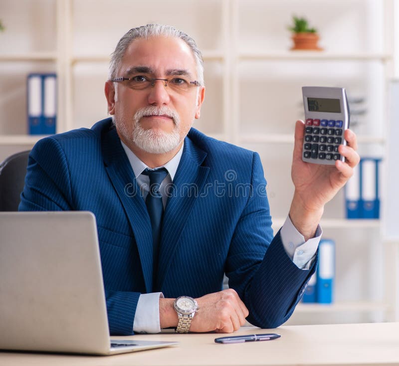 Old Male Employee Sitting at Workplace Stock Image - Image of stack ...