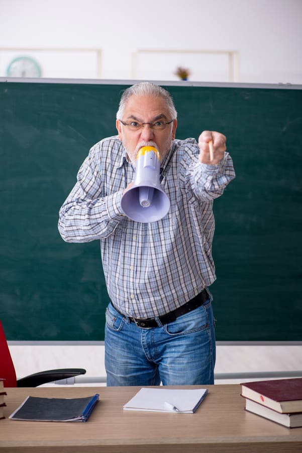 Old Male Teacher Holding Megaphone in the Classroom Stock Photo - Image ...