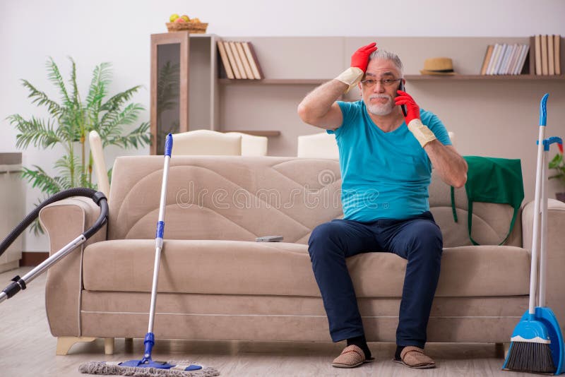 Old man cleaning the house stock image. Image of frustrated - 222583885