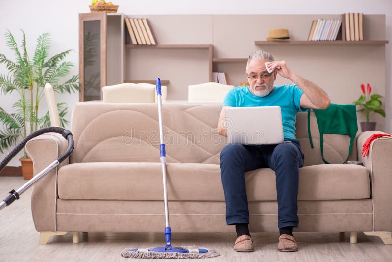 Old man cleaning the house stock image. Image of mopping - 223423909