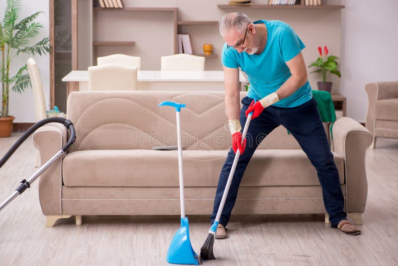 Old man cleaning the house stock photo. Image of contractor - 225703248