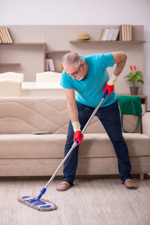 Old man cleaning the house stock image. Image of janitor - 225703291