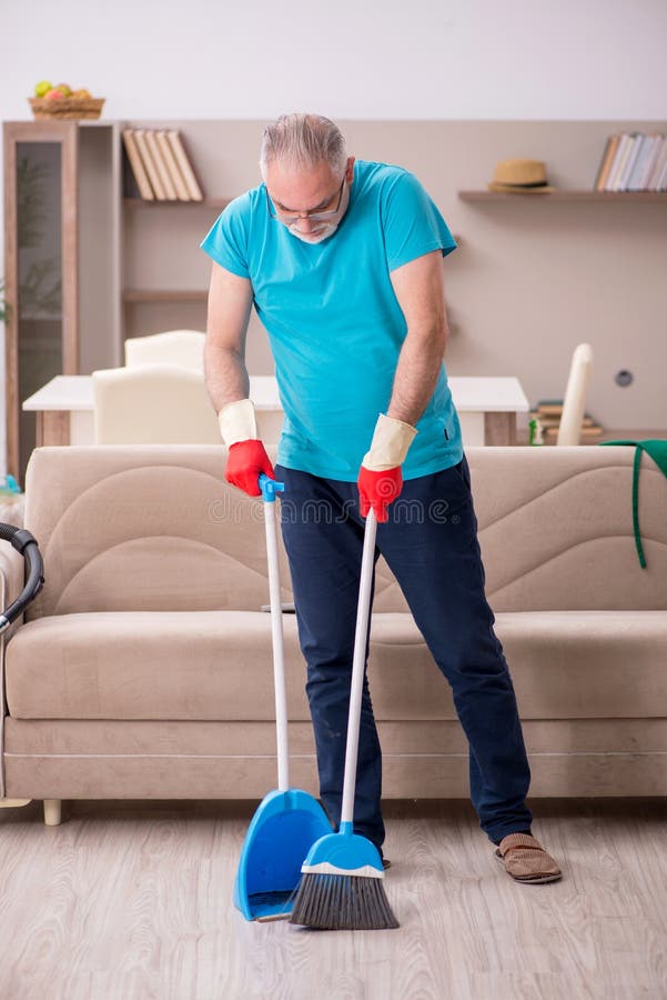 Old man cleaning the house stock photo. Image of clean - 226811288