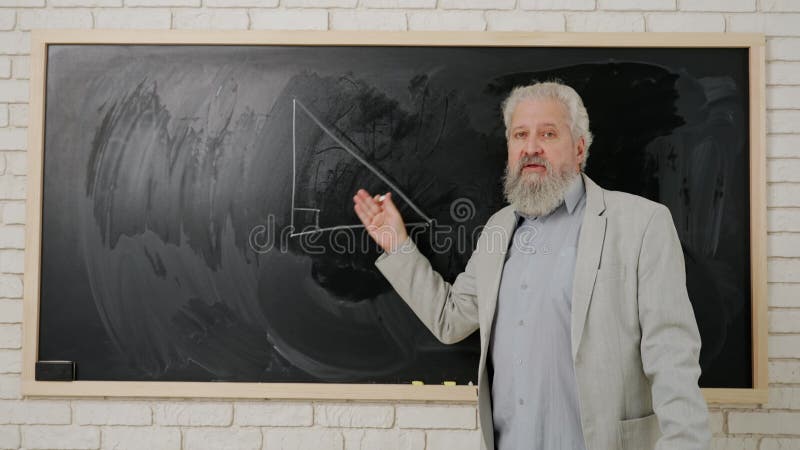 Aged Man College Professor Standing in Classroom in Front of Chalkboard ...