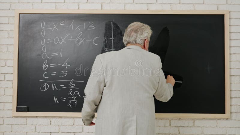 Aged Man College Professor Standing in Classroom in Front of Chalkboard ...