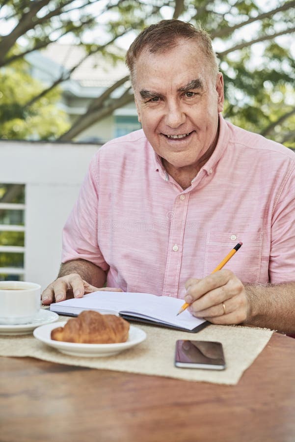 Aged Man Taking Notes in Journal Stock Photo - Image of male, outdoors ...