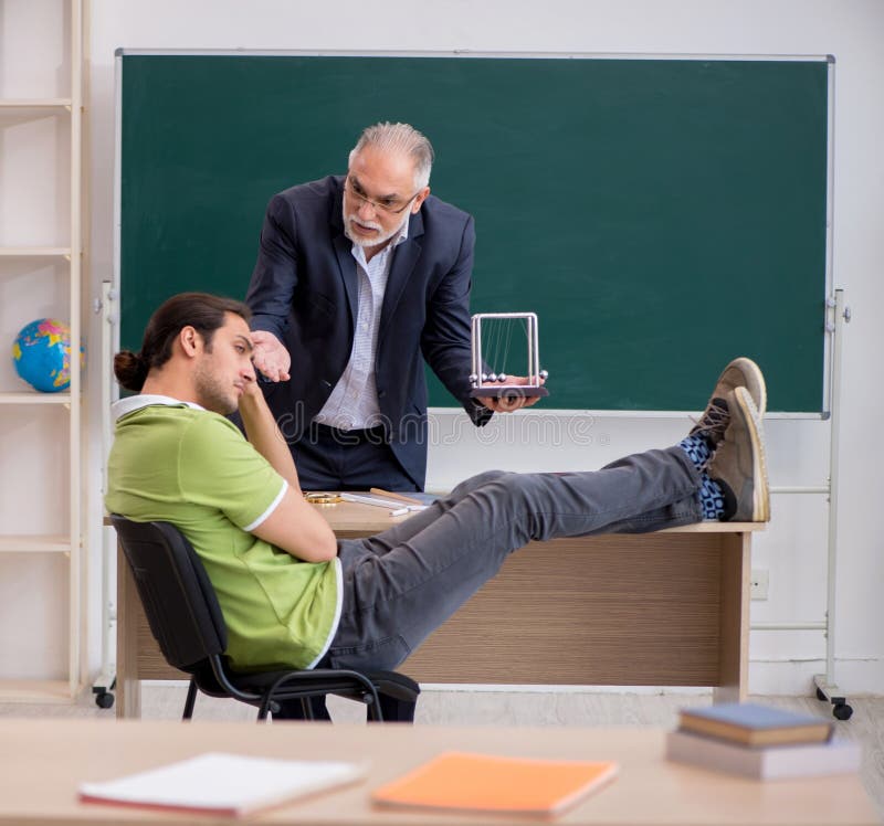 Aged Physics Teacher and Male Student in the Classroom Stock Photo ...
