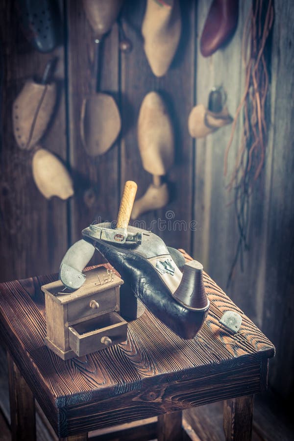 Aged Shoemaker Workshop with Tools, Leather and Shoes Stock Image ...