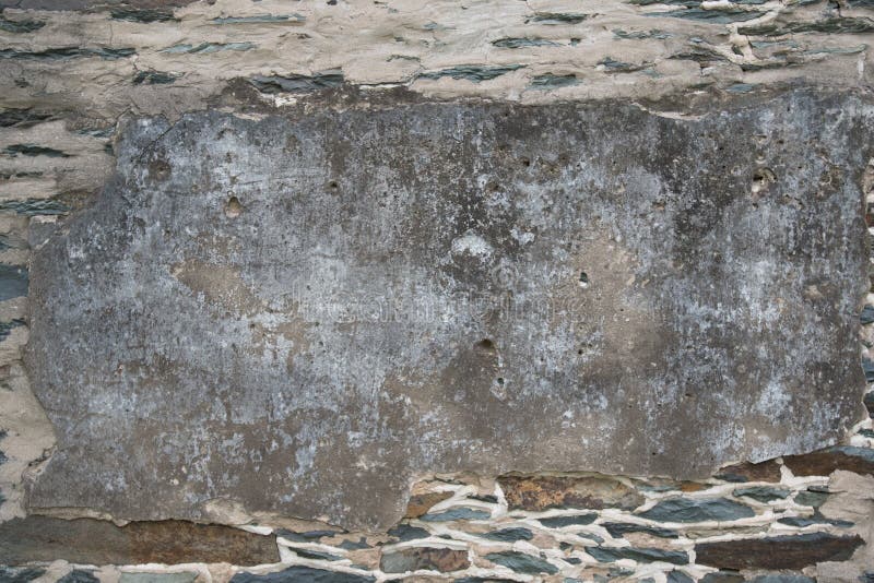 Aged Stone Wall with Patch stock image. Image of thick - 75584127