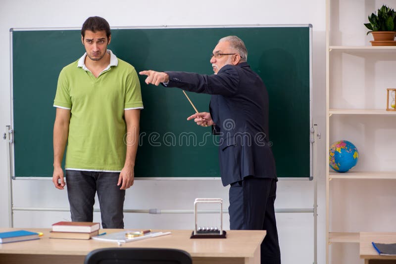 Aged Teacher and Male Lazy Student in the Classroom Stock Photo - Image ...