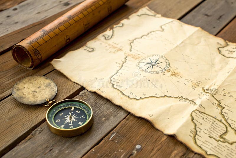 Aged Treasure Map, Ruler and Old Brass Compass on Wooden Table Stock ...