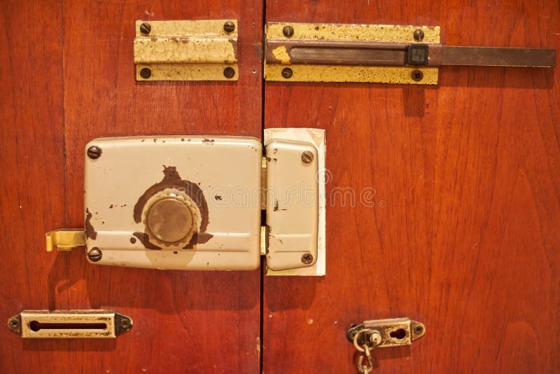 Aged Vintage Door Locks on a Wooden Door with Chain and Security Stock ...