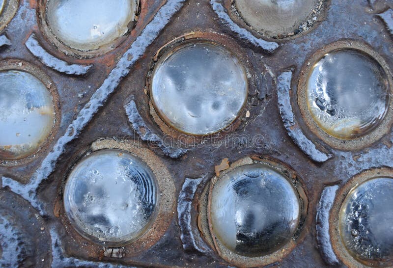 Old Rusty Dirty Metal Surface with Round Glass Inserts Background Stock ...