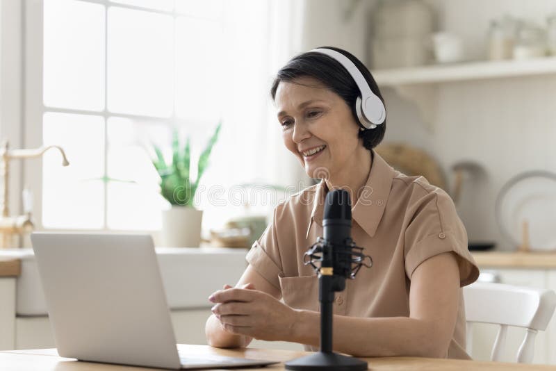 Woman Talks into Microphone during Webinar or Podcast at Home Stock ...