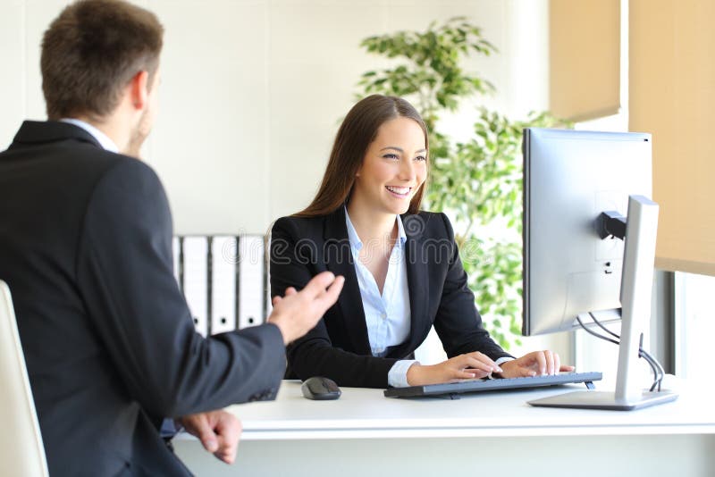 Agent Attending a Client at Office Stock Photo - Image of agent ...