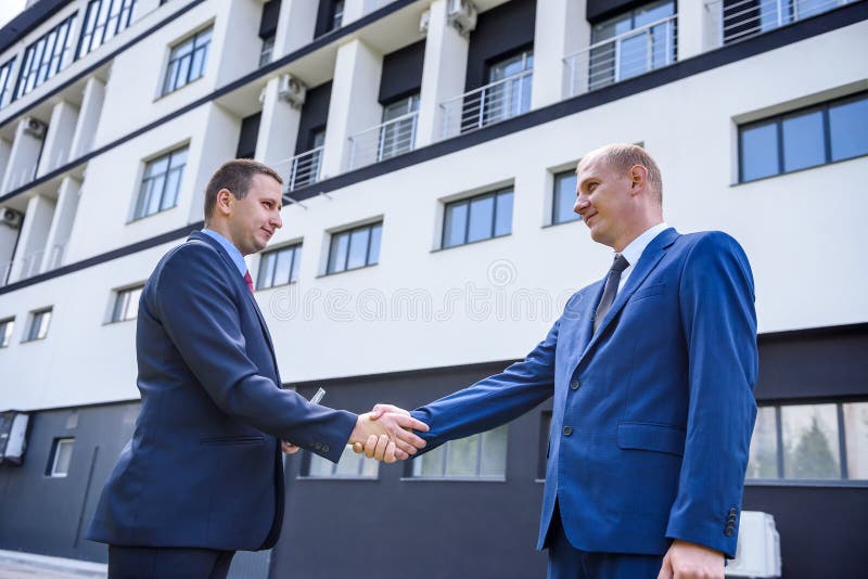 Agent with Buyer Posing on Construction Site Stock Photo - Image of ...