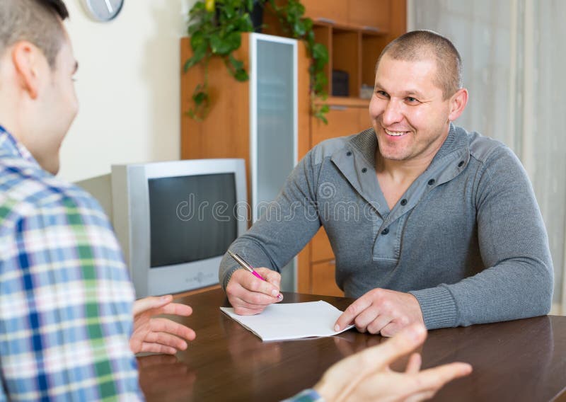 Agent and Client with Documents at Home Stock Image - Image of ...