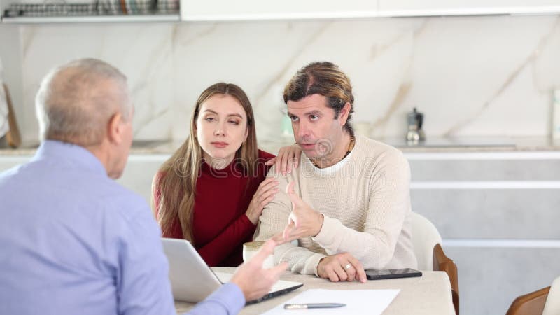 Agent Explaining, Suggesting and Making Offer To Couple. Agent Making ...