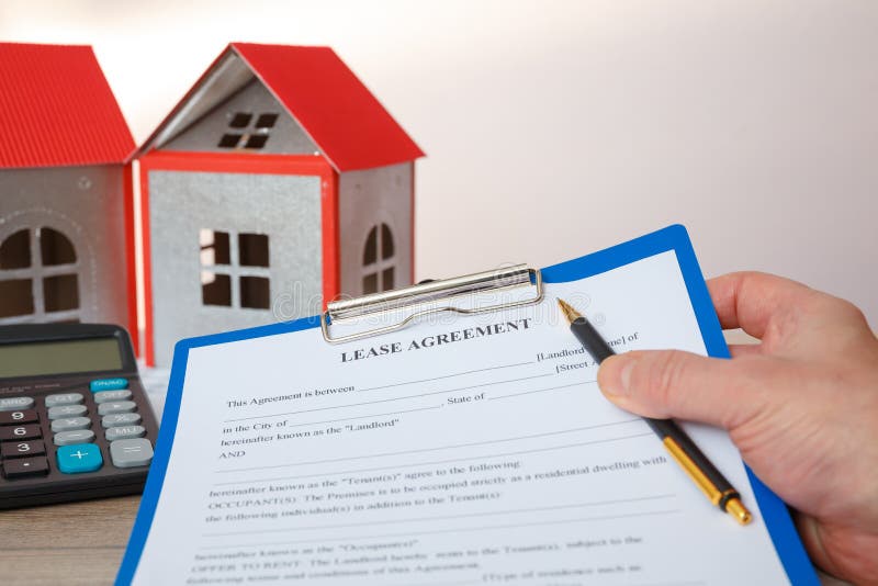 The Agent Holds the Lease of Real Estate, House Models, Calculator ...