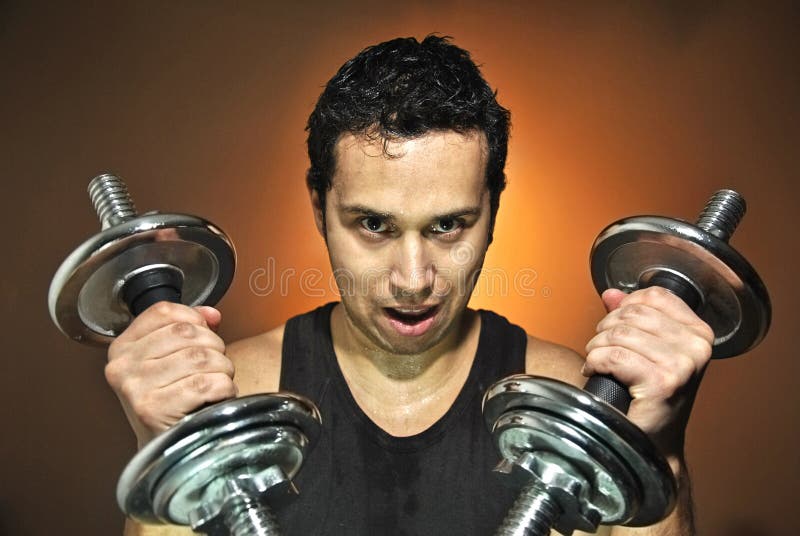 Aggressive Athlete Training with Dumbbells Stock Image - Image of model ...