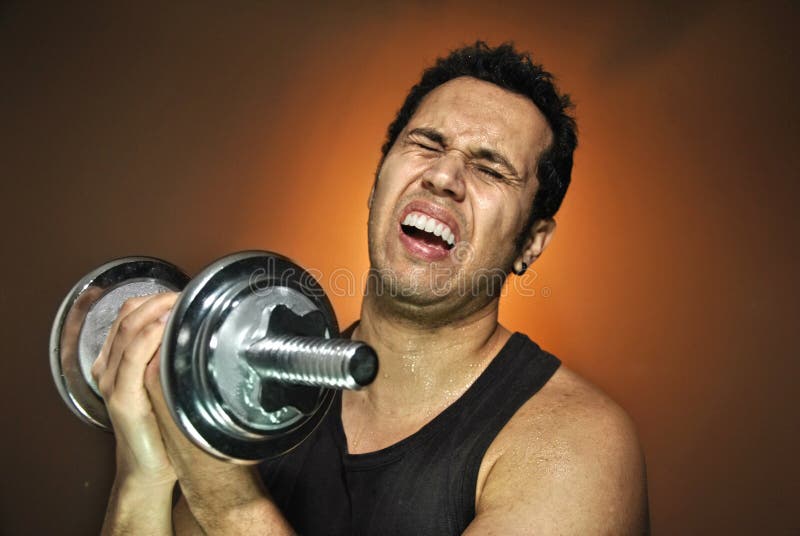 Aggressive Athlete Training with Dumbbells Stock Image - Image of model ...