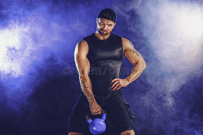 Aggressive Bearded Muscular Bodybuilder Doing Exercise for the Biceps ...