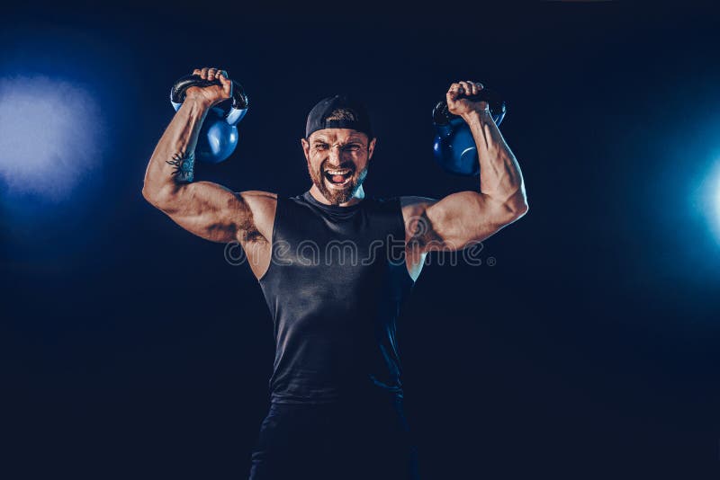Aggressive Bearded Muscular Bodybuilder Doing Exercise for the S Stock ...