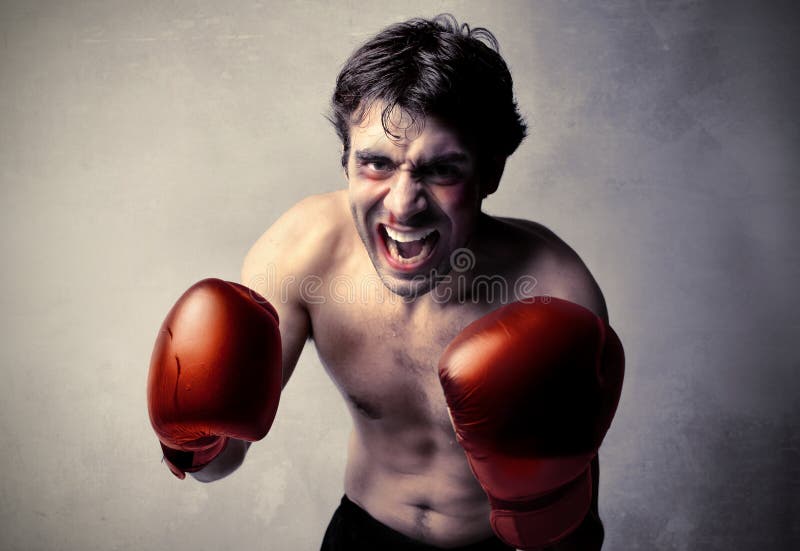 Aggressive Boxer Man Boxing in Fighting Gloves Throwing Angry Right ...