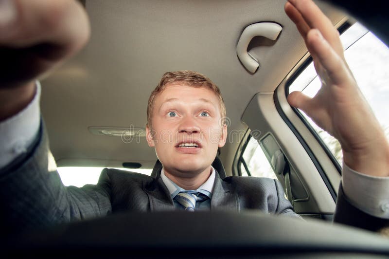 Angry Driver Behind the Wheel of a Car while Driving Stock Image ...