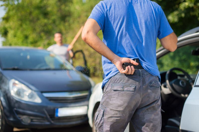Aggressive Drivers Attacking Each Other with Weapons in Traffic on Road ...