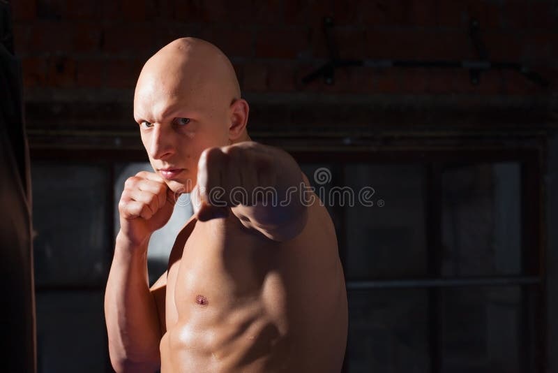 Aggressive MMA Fighter Punching Opponent on Floor on Mat at Gym, during ...