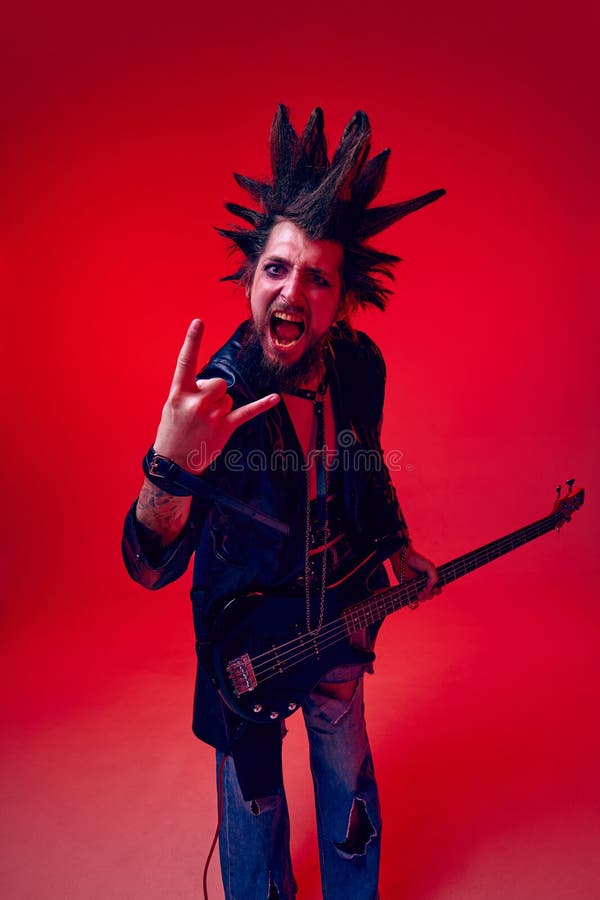 Aggressive Impressive Pose. Rok Musician, Man Posing with Hand Gesture ...