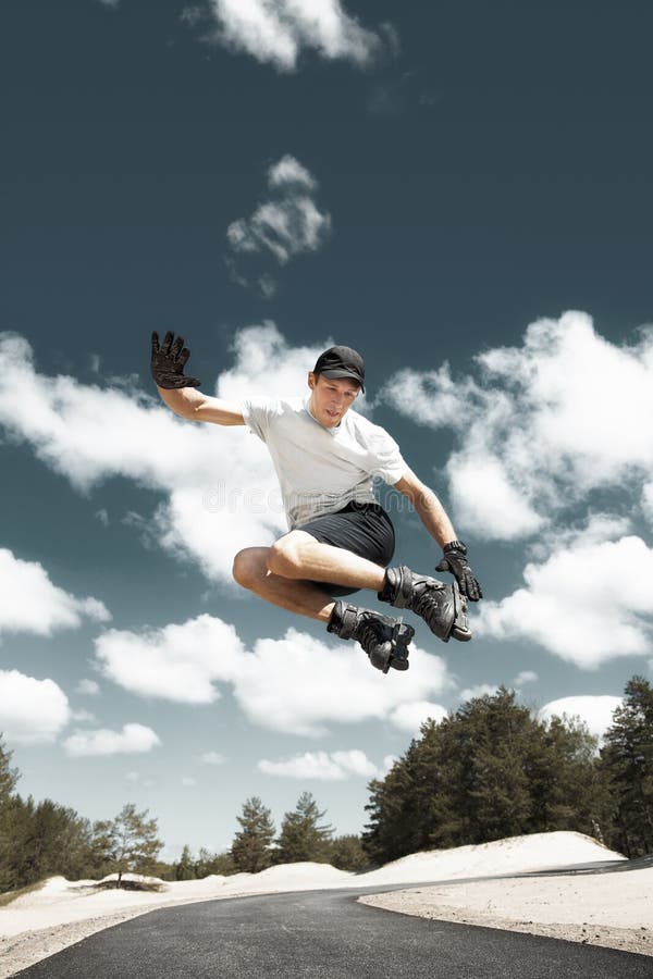 Aggressive Riding. a Young Athlete Performs a Roller Skate Jump. Stock ...
