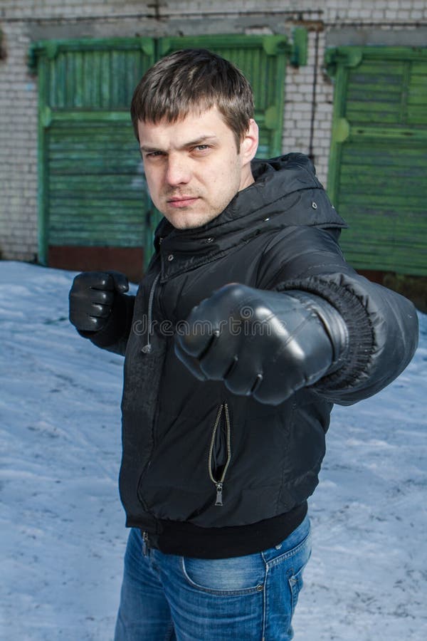 Angry Man Punching in a Street Fight. Stock Photo - Image of ...