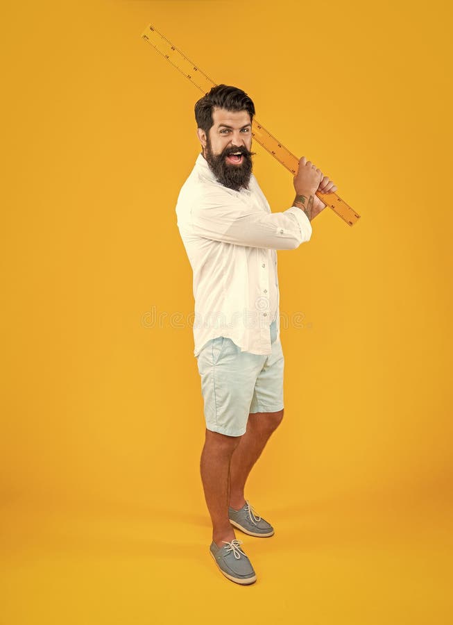 Aggressive Man with Measuring Ruler in Studio. Man with Measuring Ruler ...