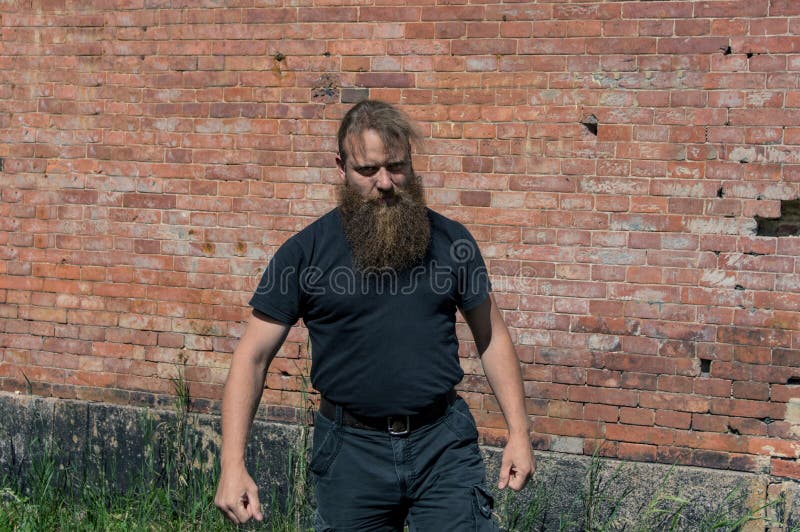 An Aggressive Person with a Beard in Motion Stock Image - Image of ...