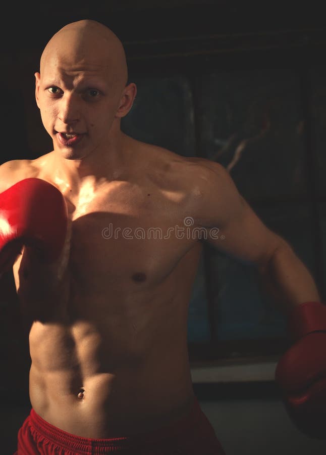 Aggressive Boxer Man Boxing in Fighting Gloves Throwing Angry Right ...