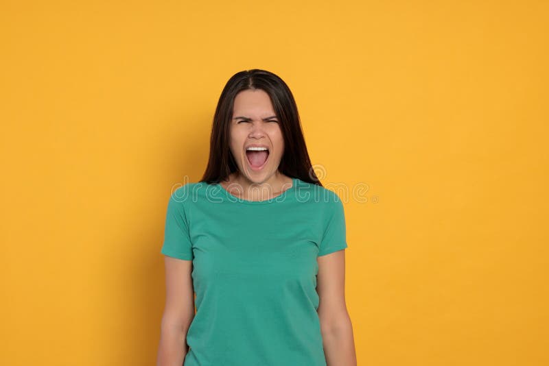 Aggressive Young Woman Shouting on Orange Background Stock Photo ...