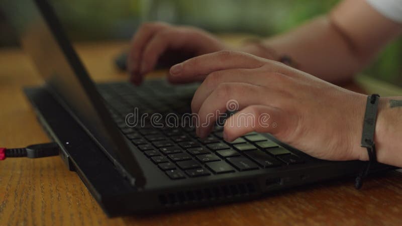 Close-up of Coders Hands Typing on Laptop, Programming in a Tech Environment. Agile Fingers ...