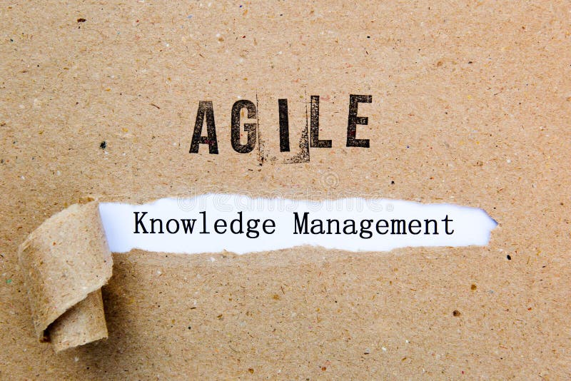 Agile Knowledge Management - Printed Text Underneath Torn Brown Paper ...