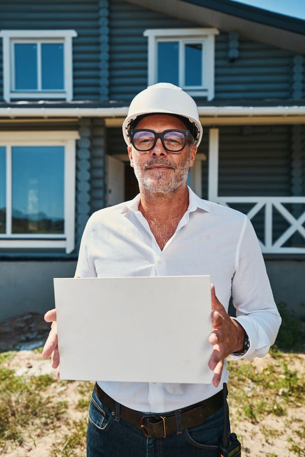 Confident Engineer Holding Blank Piece of Paper Stock Photo - Image of ...