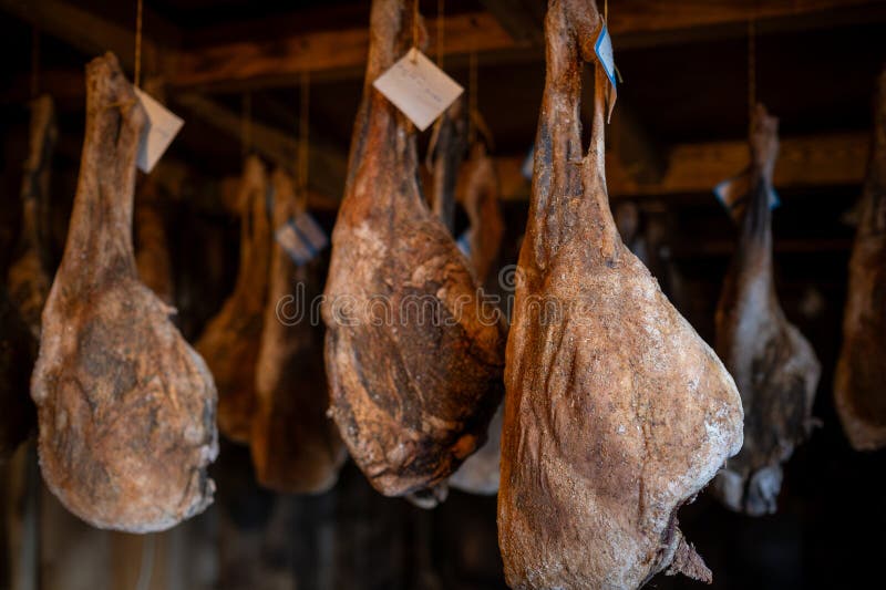 Aging Hams Hanging in Traditional Curing Room Stock Photo - Image of ...
