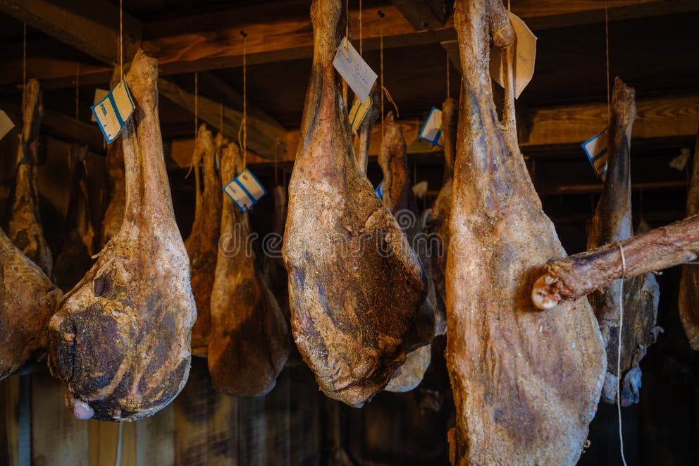 Aging Hams Hanging in Traditional Curing Room Stock Photo - Image of ...